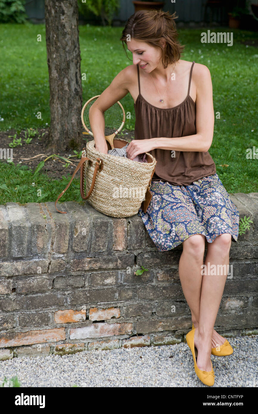 Woman rummaging through purse Stock Photo - Alamy
