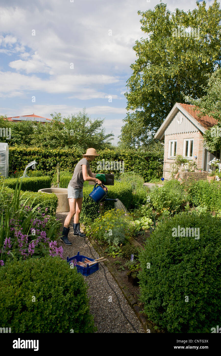 Woman gardening in backyard Stock Photo - Alamy