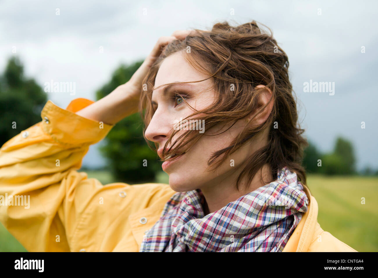 Smiling woman walking outdoors Stock Photo - Alamy