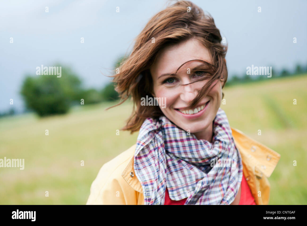 Smiling woman walking outdoors Stock Photo - Alamy