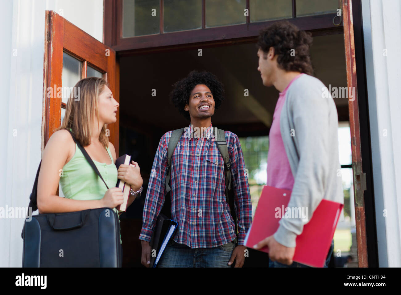 Students talking on campus Stock Photo - Alamy