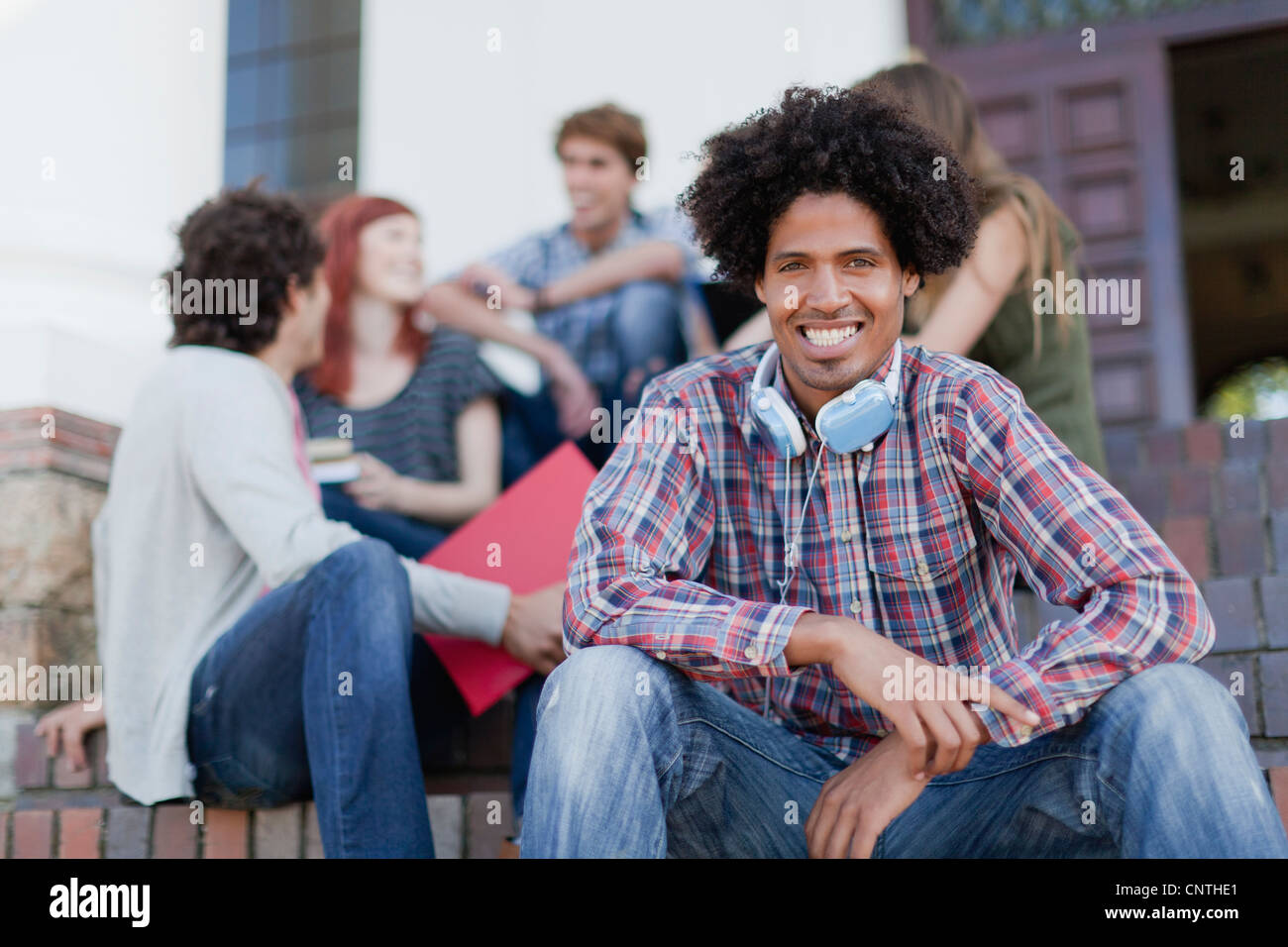 Students sitting together on campus Stock Photo - Alamy