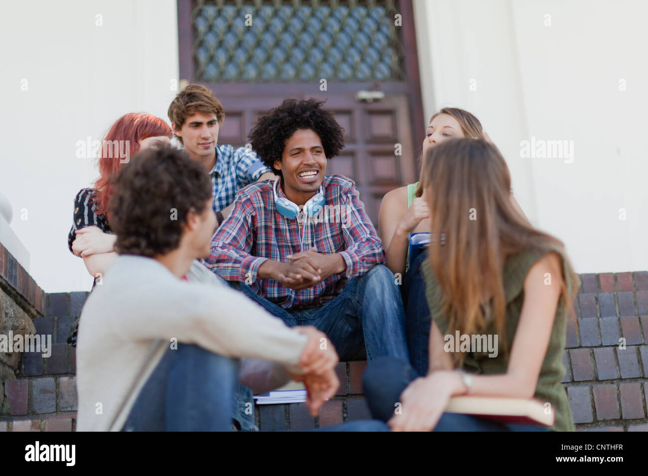 Students sitting together on campus Stock Photo - Alamy