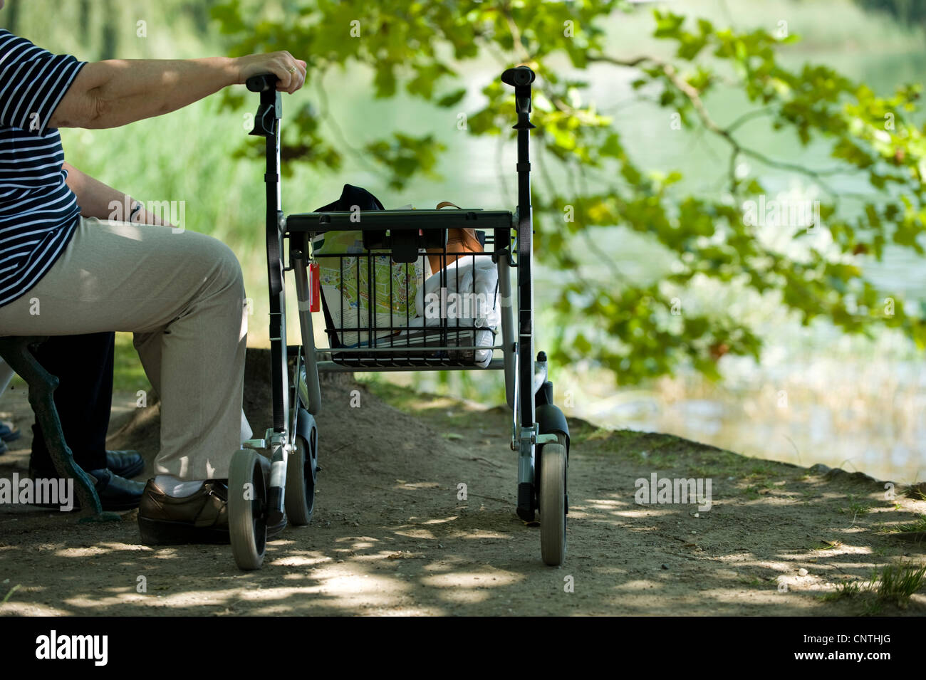 Elderly man walking zimmer frame hi-res stock photography and images ...