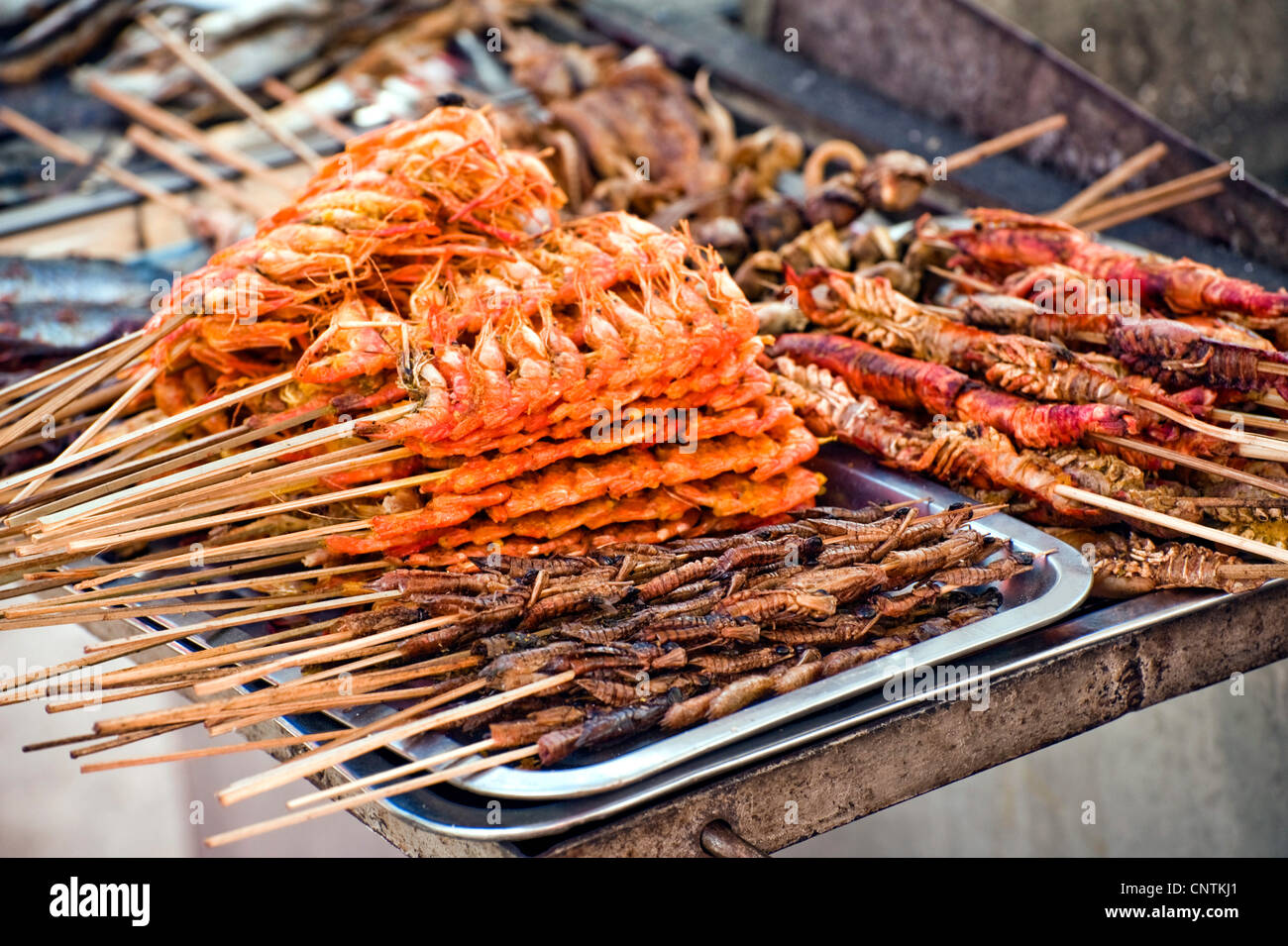shrimps and grasshopper on spit, China, China Stock Photo - Alamy