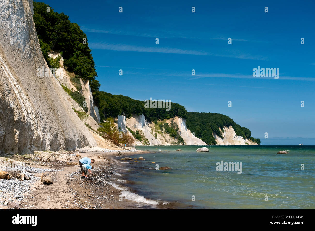 to boys under the chalk cliff in Jasmund National Park, Germany ...