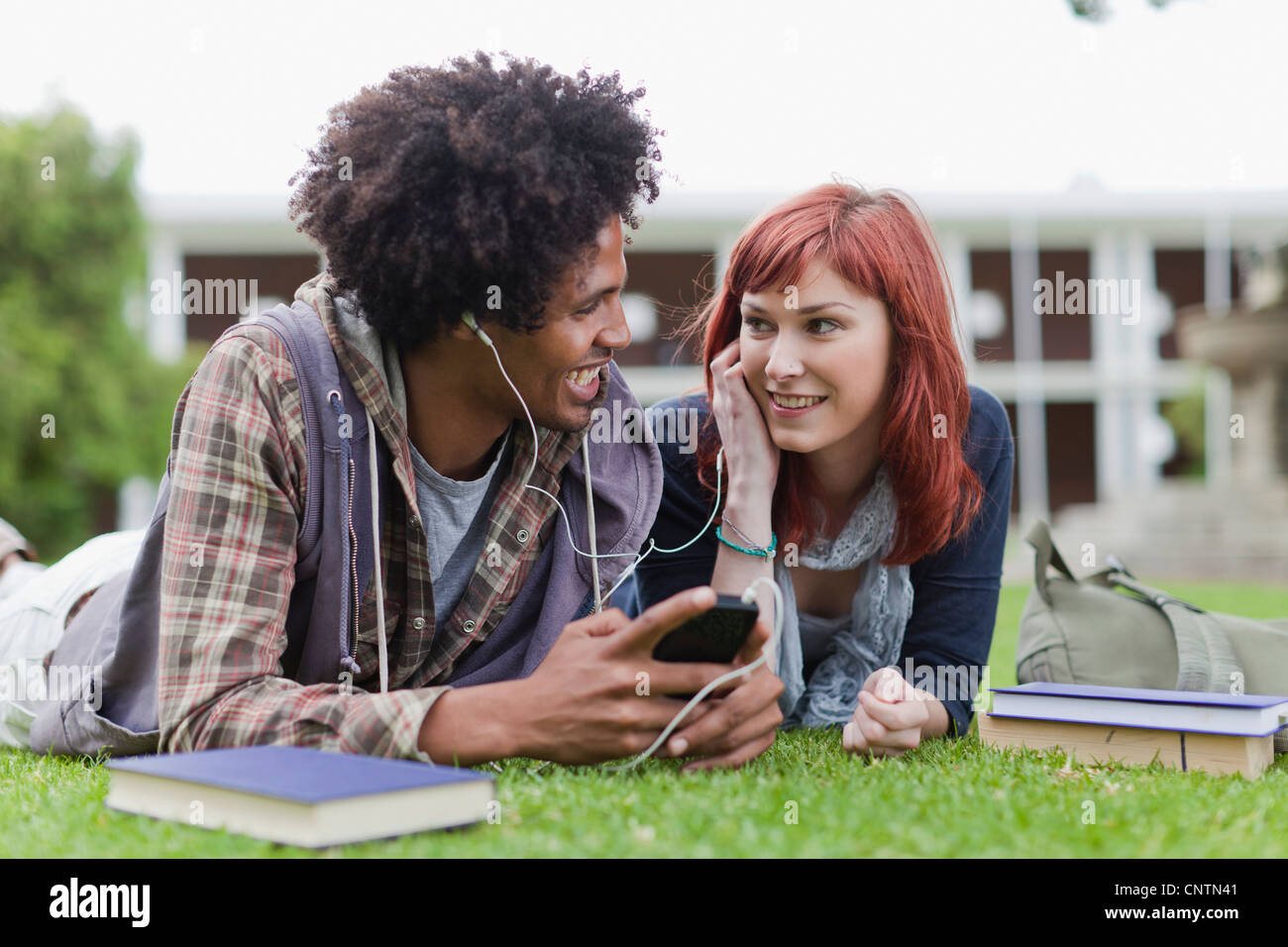 Students listening to mp3 player Stock Photo - Alamy