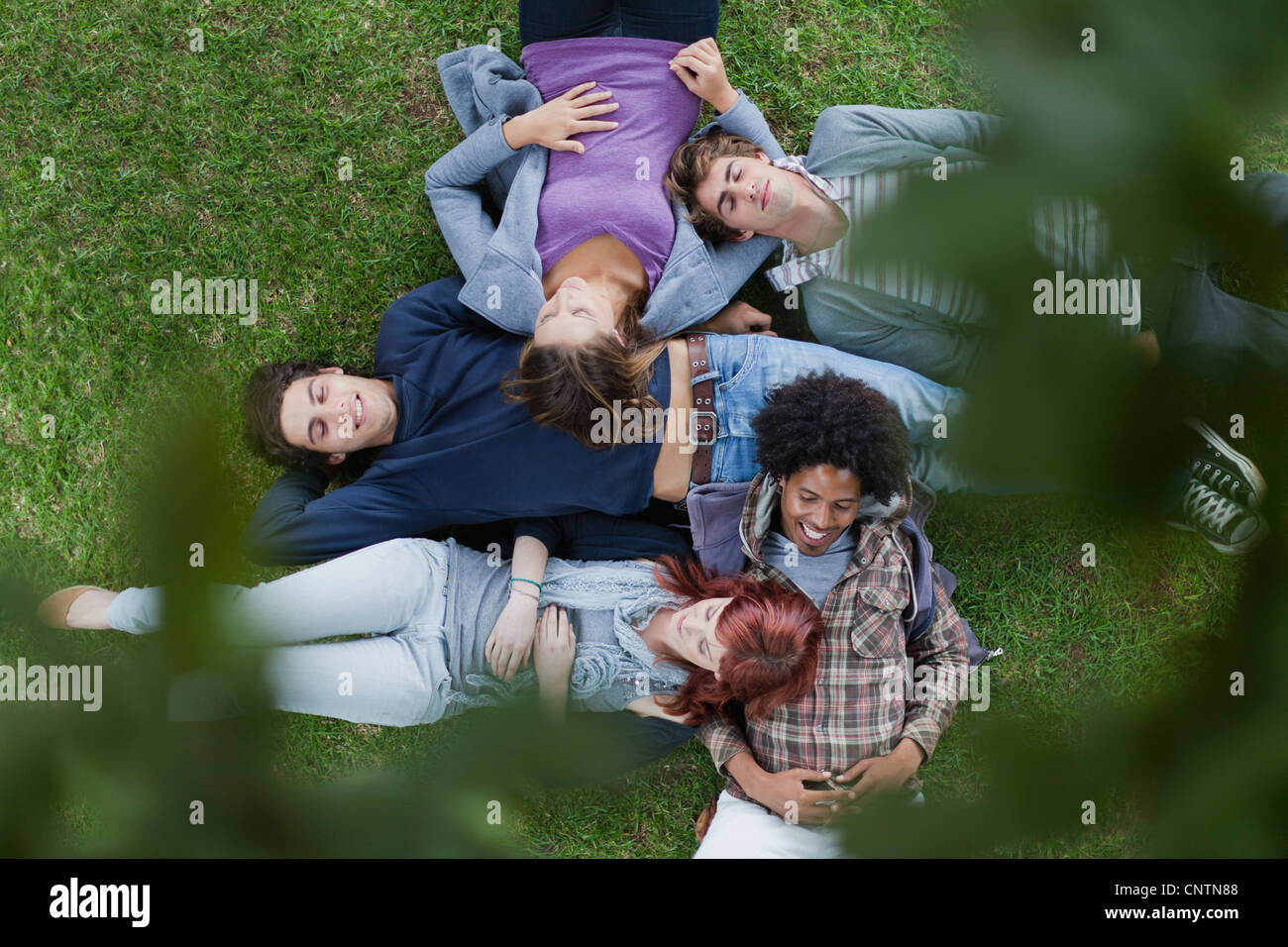 Students laying on grass hi-res stock photography and images - Alamy