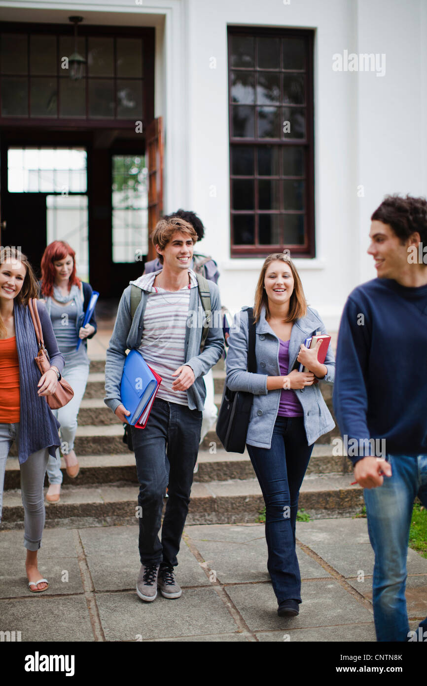 Students walking together on campus Stock Photo - Alamy