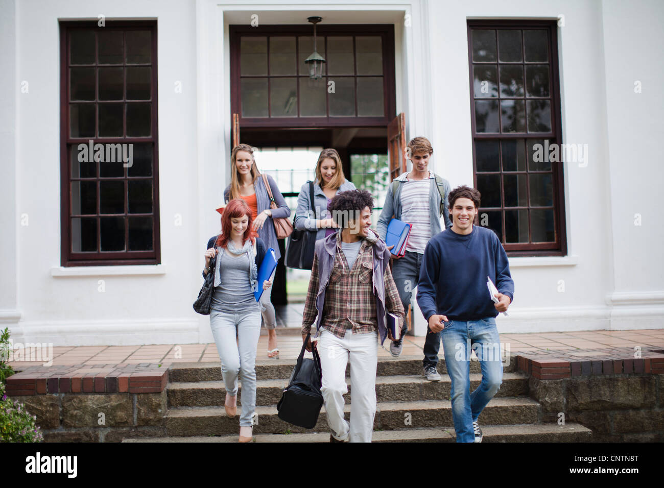 Students walking together on campus Stock Photo - Alamy
