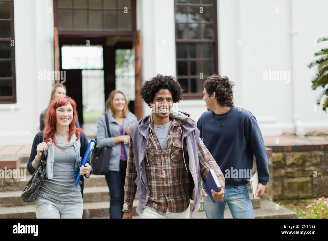 Students walking together on campus Stock Photo - Alamy