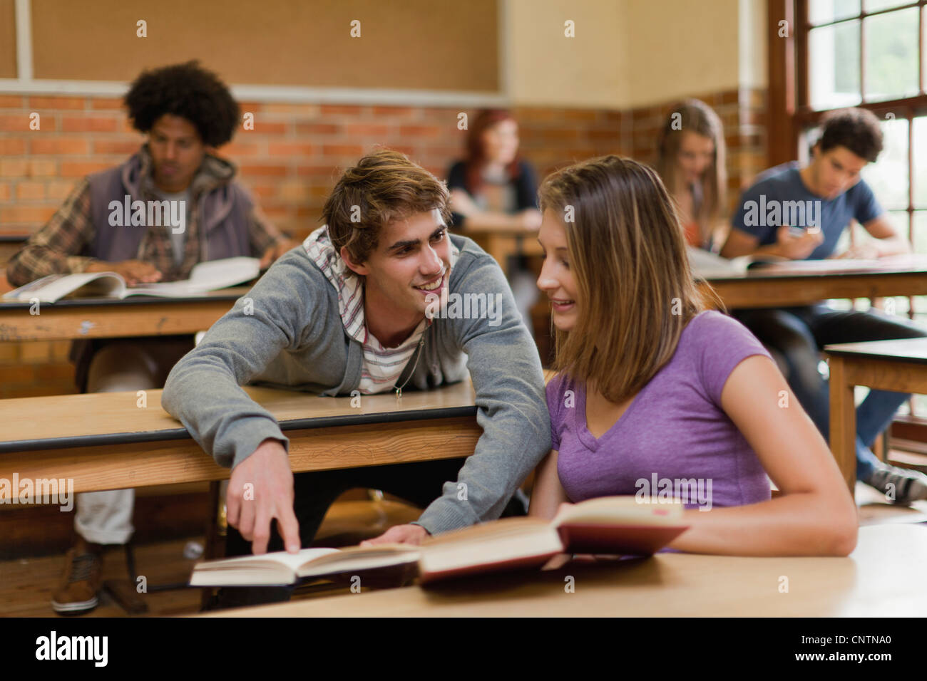 Students working together in class Stock Photo - Alamy