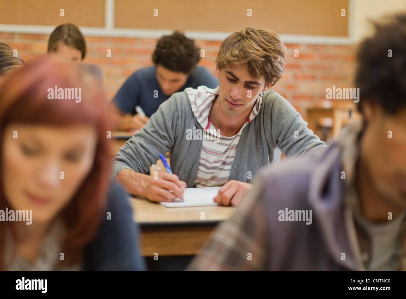Students working in class Stock Photo - Alamy