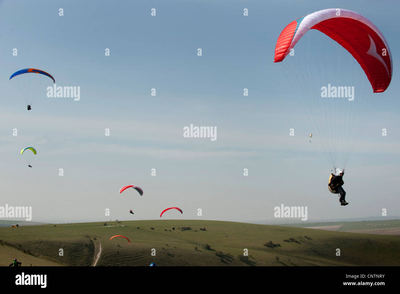 Parascender flying over the South Downs at Devil's Dyke Stock Photo - Alamy
