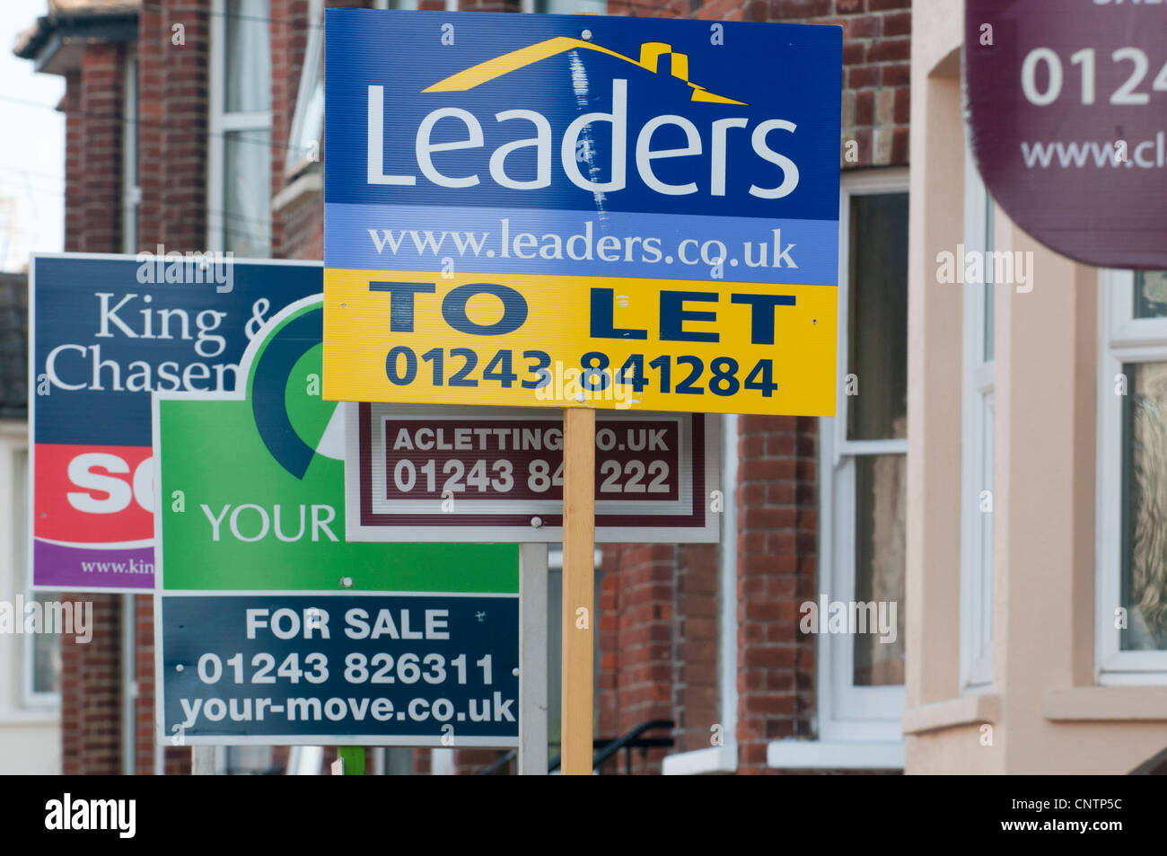 Estate agents' sale boards in Littlehampton, West Sussex Stock Photo ...