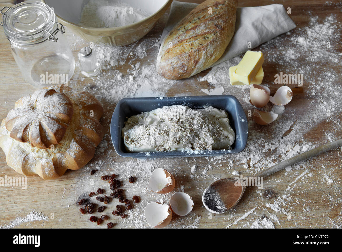 Bread loaves and dough in messy kitchen Stock Photo - Alamy