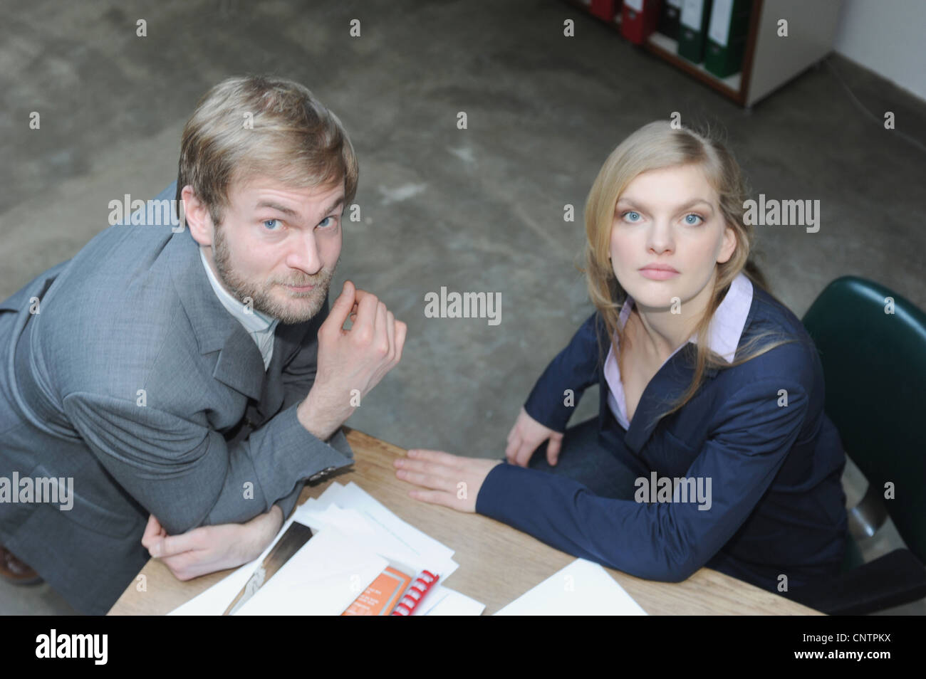 Business people talking at desk Stock Photo - Alamy