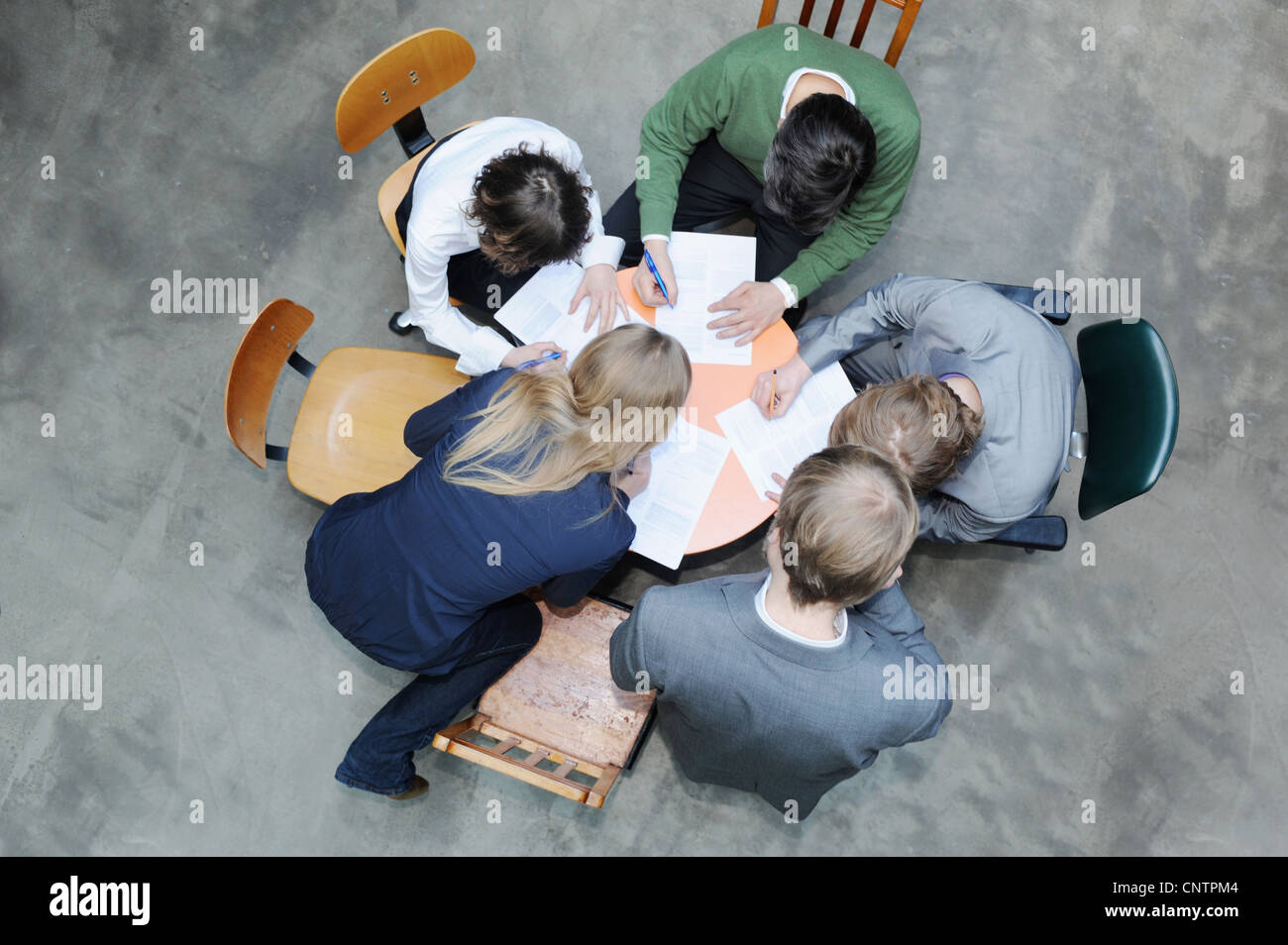 Overhead view of business people at desk Stock Photo - Alamy