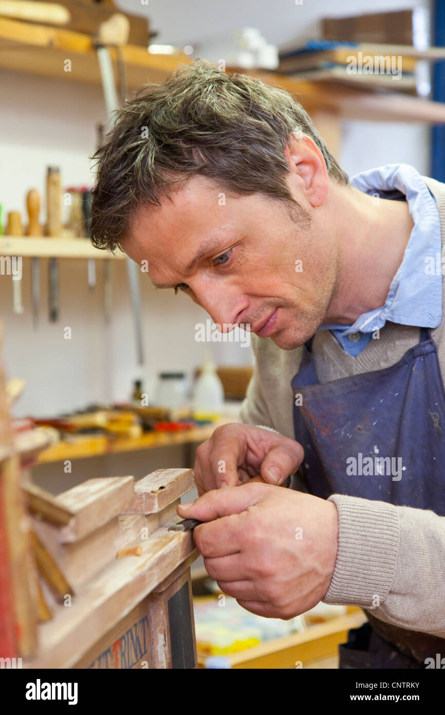 Carpenter working in shop Stock Photo - Alamy