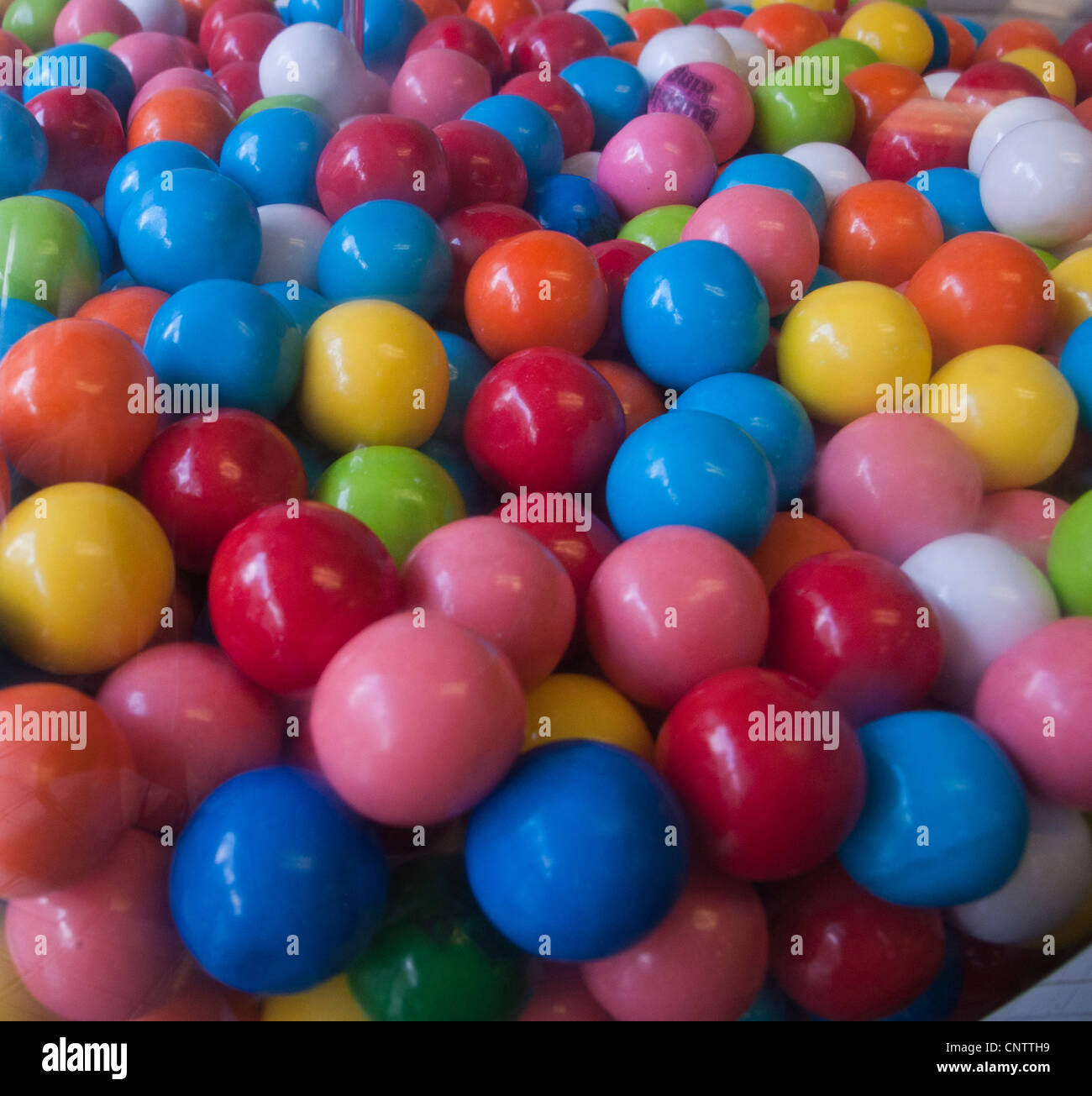 Colorful bubble gum balls in a dispenser at a pizza parlor in Brooklyn ...