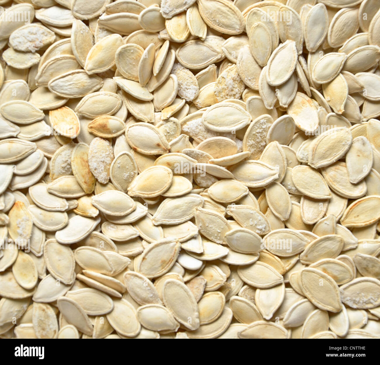 Pumpkin seeds background Stock Photo - Alamy