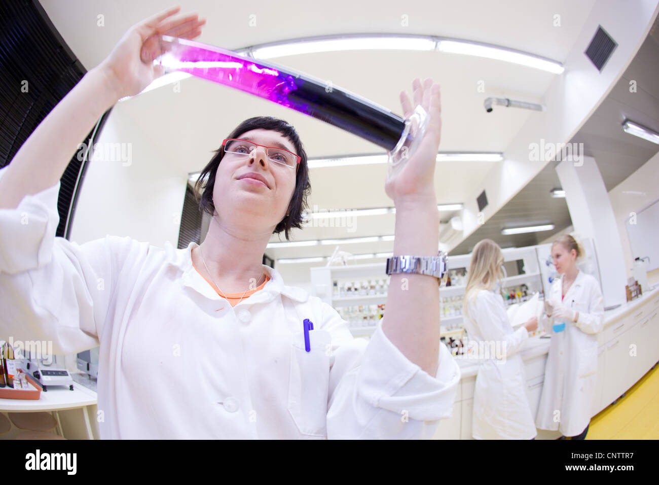 portrait of a female researcher carrying out research in a chemistry ...