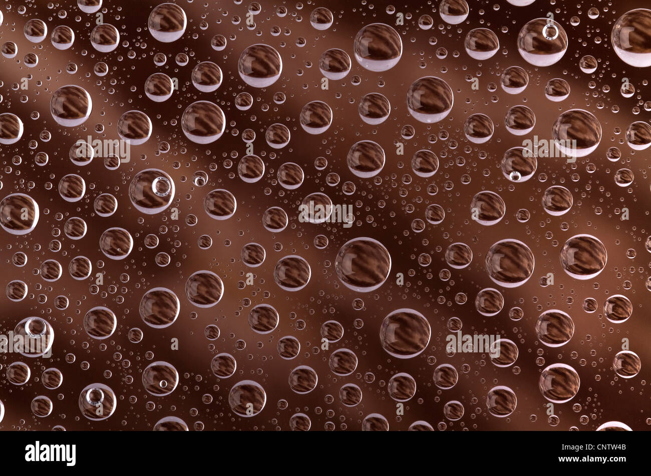 water drops over brown background, on the glass surface Stock Photo - Alamy