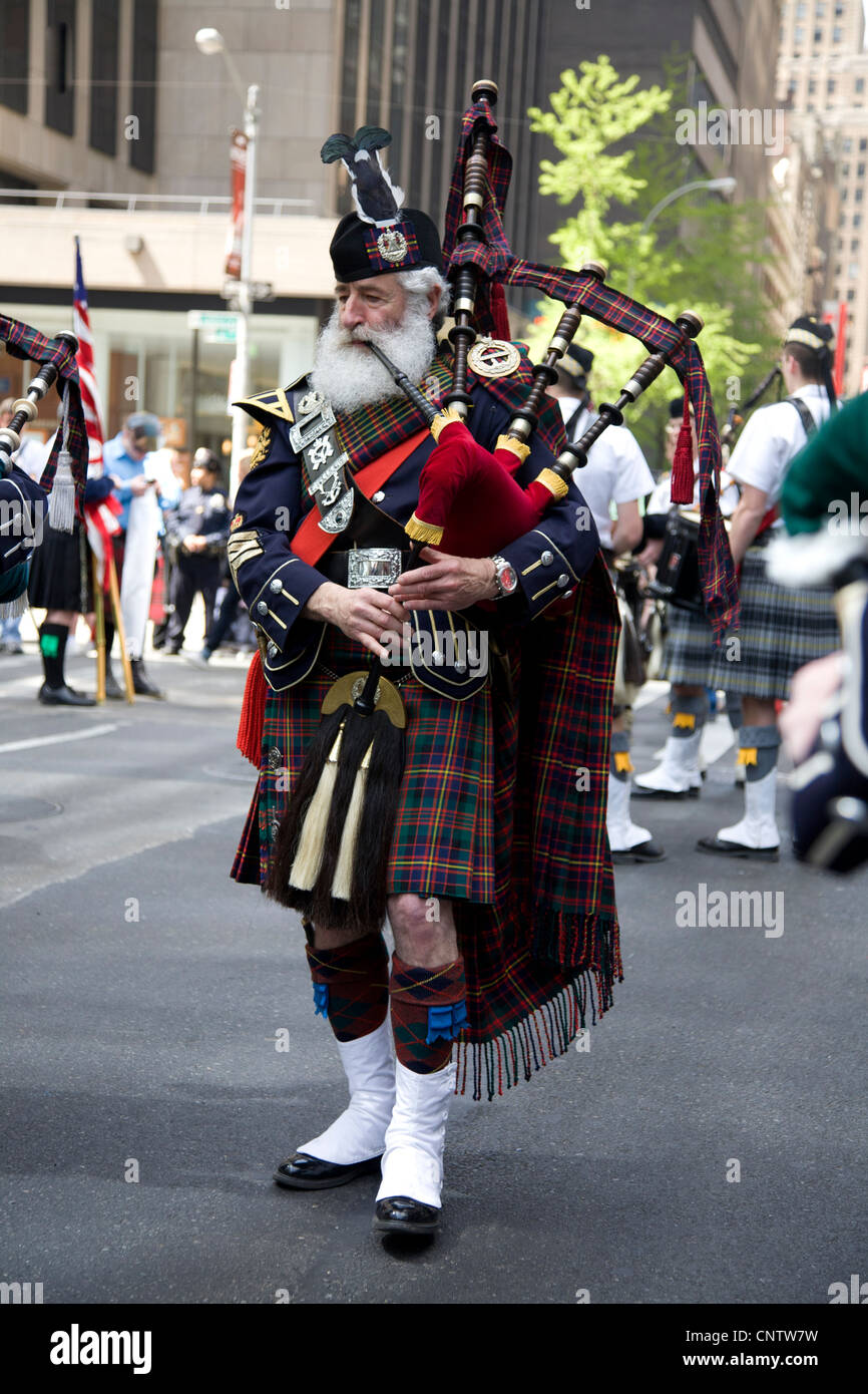 Scottish bagpipers, dancers, and onlookers enjoy the annual Tartan Day ...