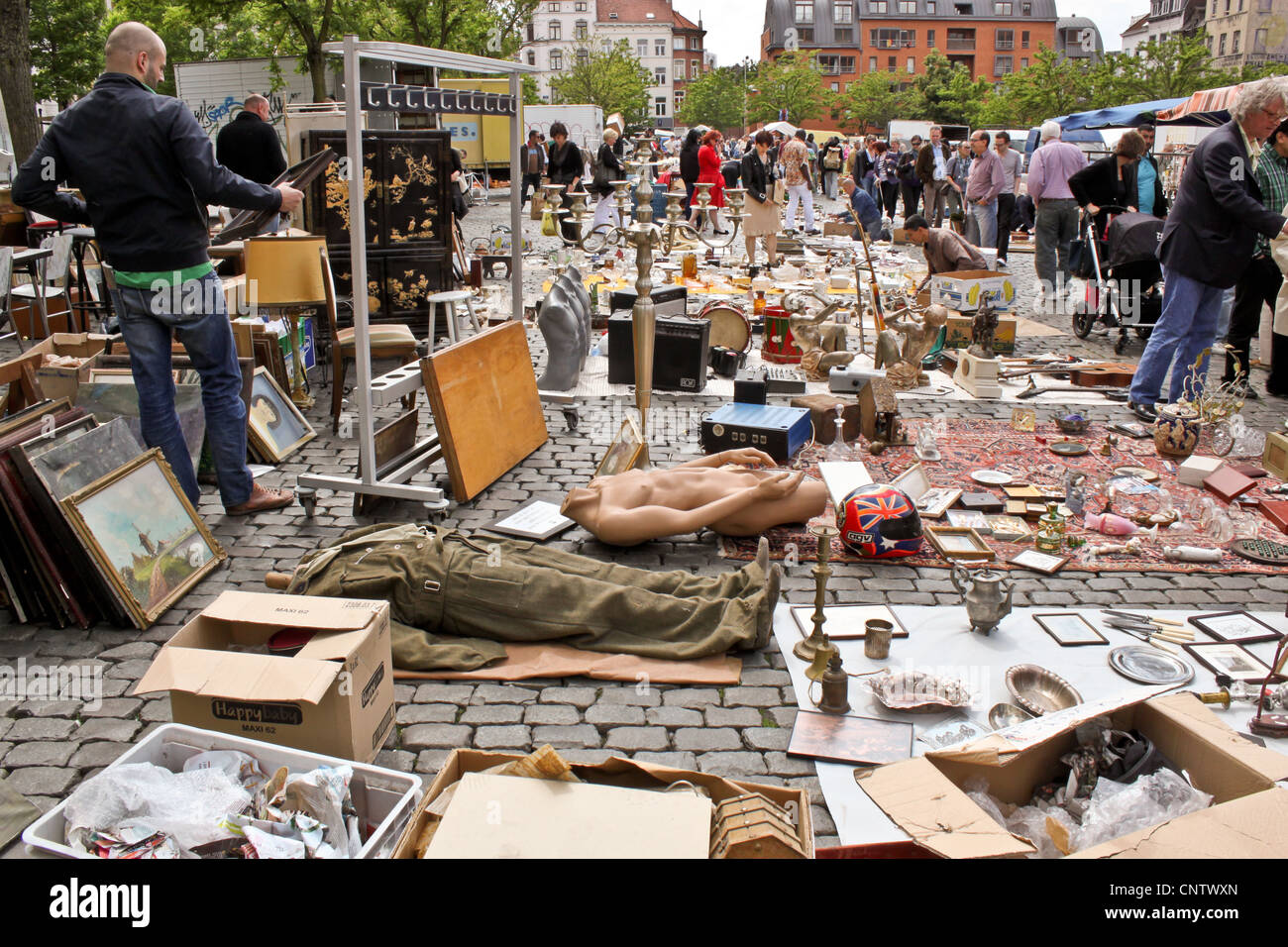 Brussels, Belgium - May 22 - people choose things on a flea market on ...