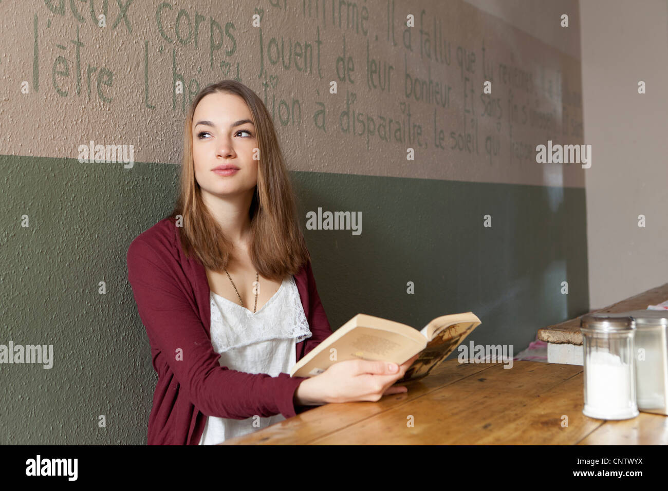 Reading book at cafe hi-res stock photography and images - Alamy