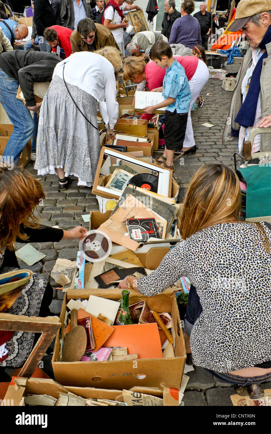 Brussels, Belgium - May 22 - people choose things on a flea market on ...