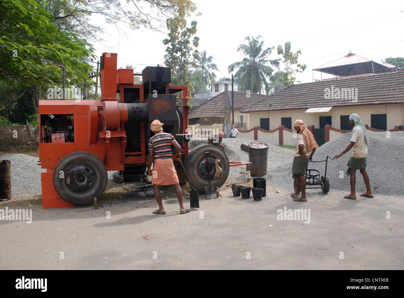 Traditional Indian workmen mend a road within the ancient port city of ...