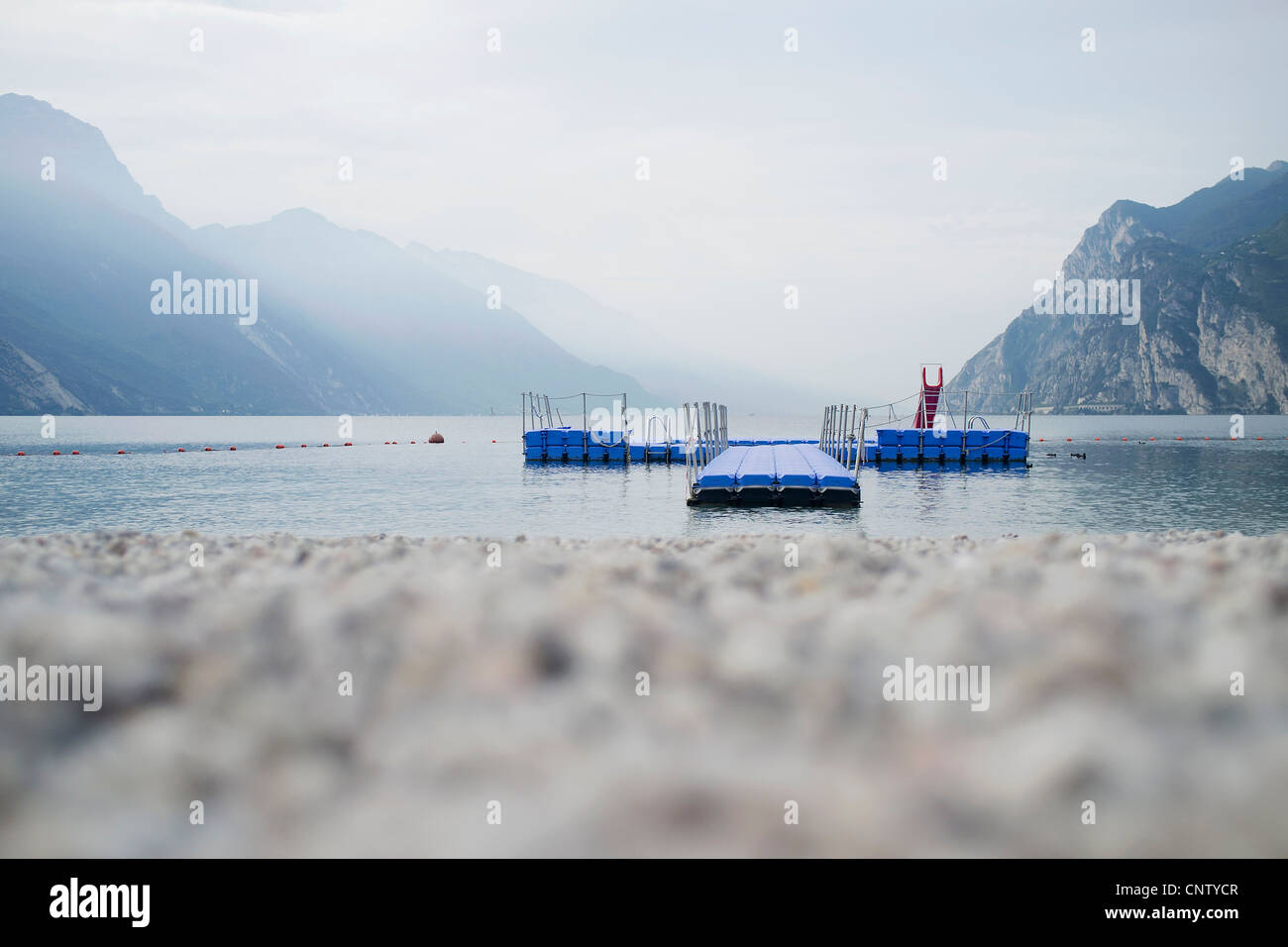 Floating pier off rocky beach Stock Photo - Alamy