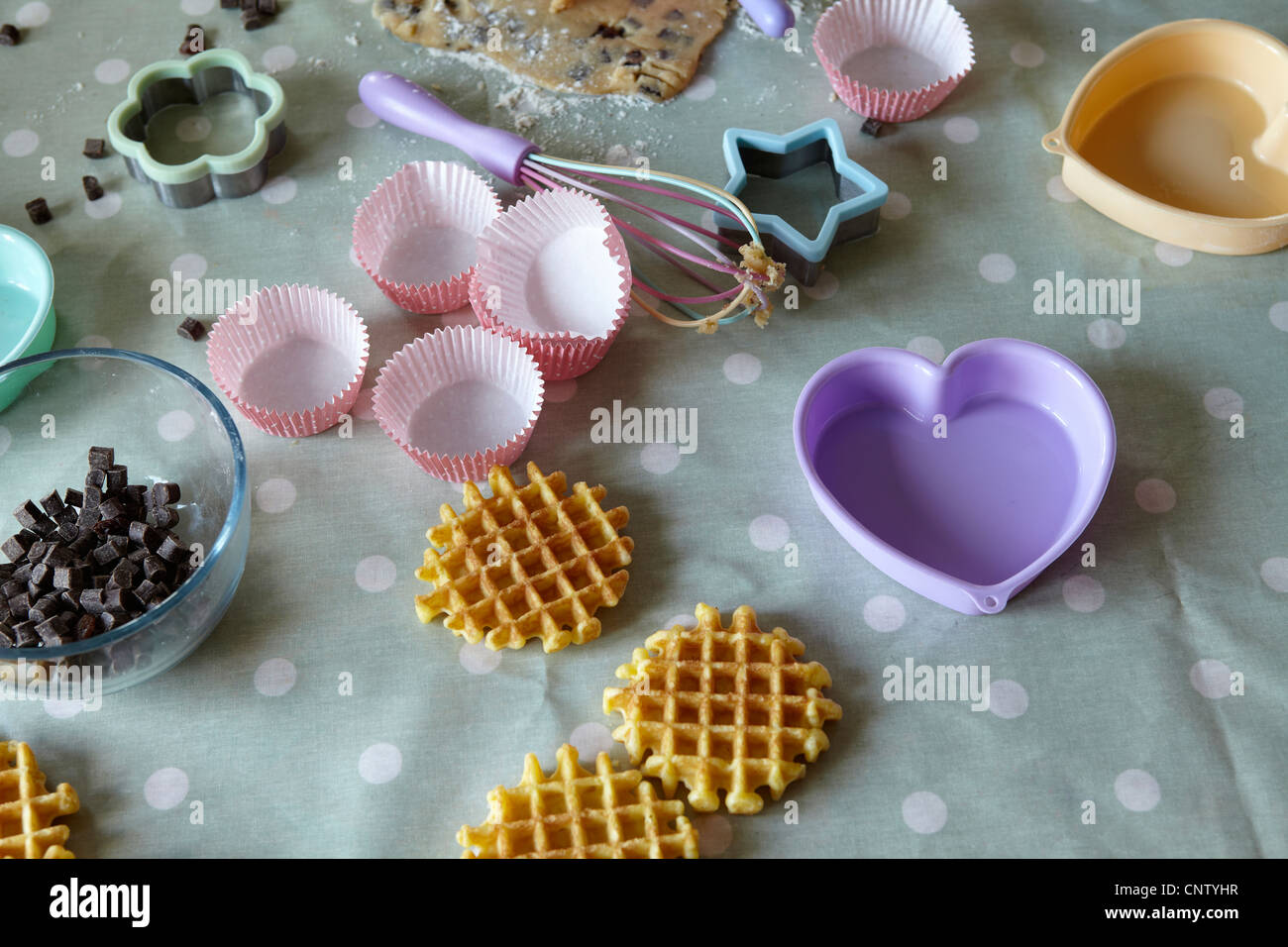 Baking implements in messy kitchen Stock Photo - Alamy