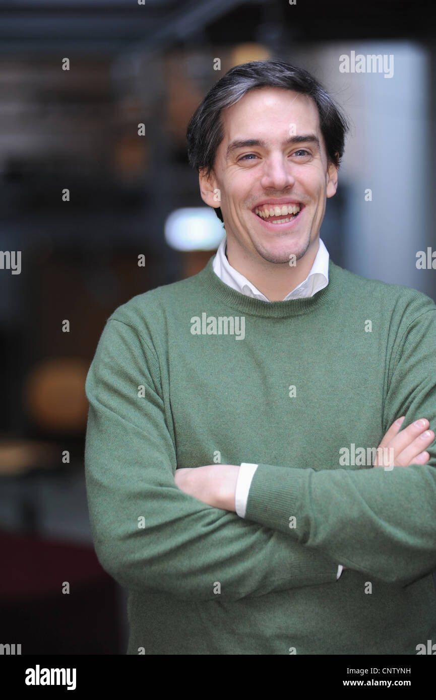 Man standing folding arms hi-res stock photography and images - Alamy