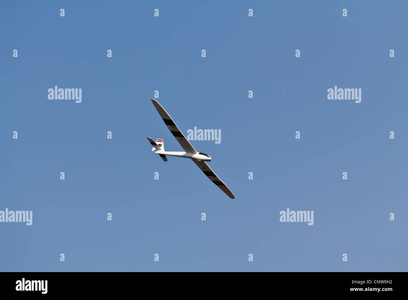 A remote glider gliding in Austria on blue sky Stock Photo - Alamy