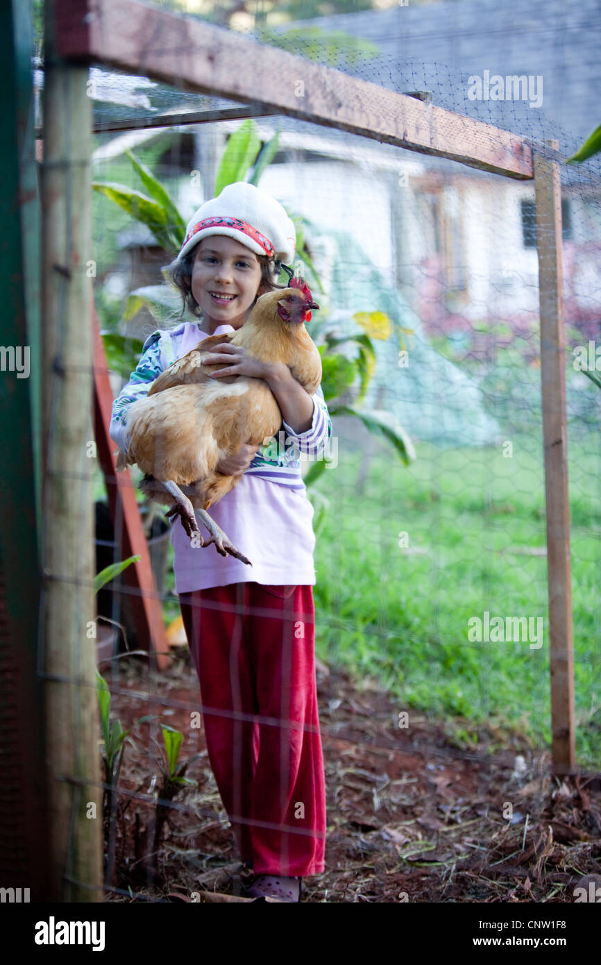 Girl hugging chicken hi-res stock photography and images - Alamy