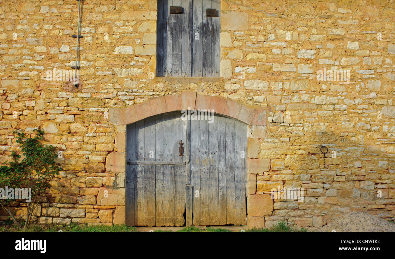 Wooden doors in old French stone barns in southern France Stock Photo ...