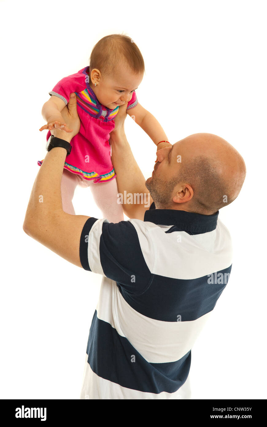 Father raising baby girl over his head isolated on white background ...