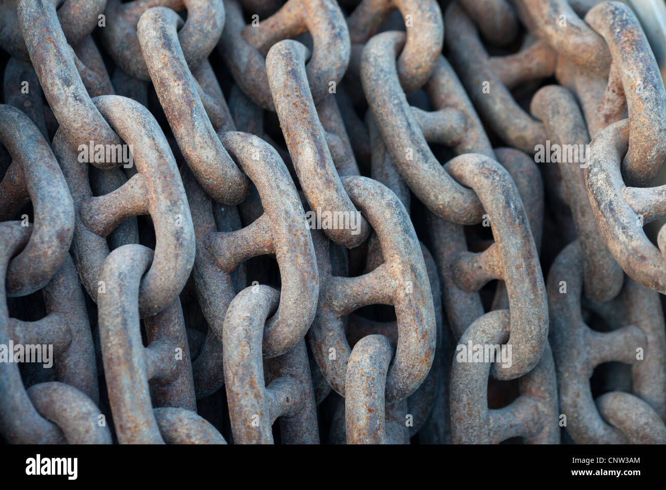 A long length of Chain coiled around a drum Stock Photo - Alamy