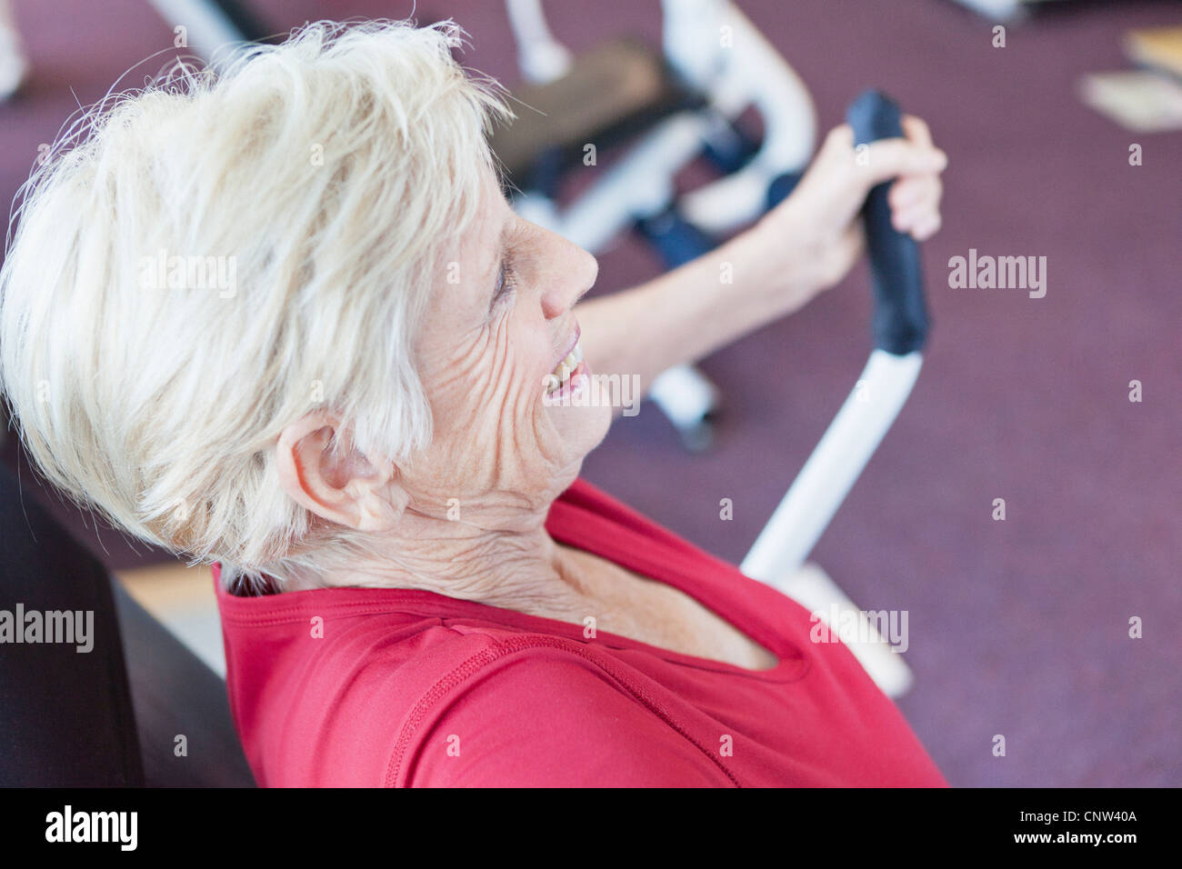 Older woman exercising in gym Stock Photo - Alamy