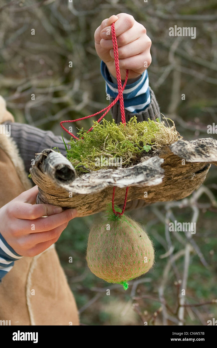 dispenser for nesting material with rain protection Stock Photo - Alamy
