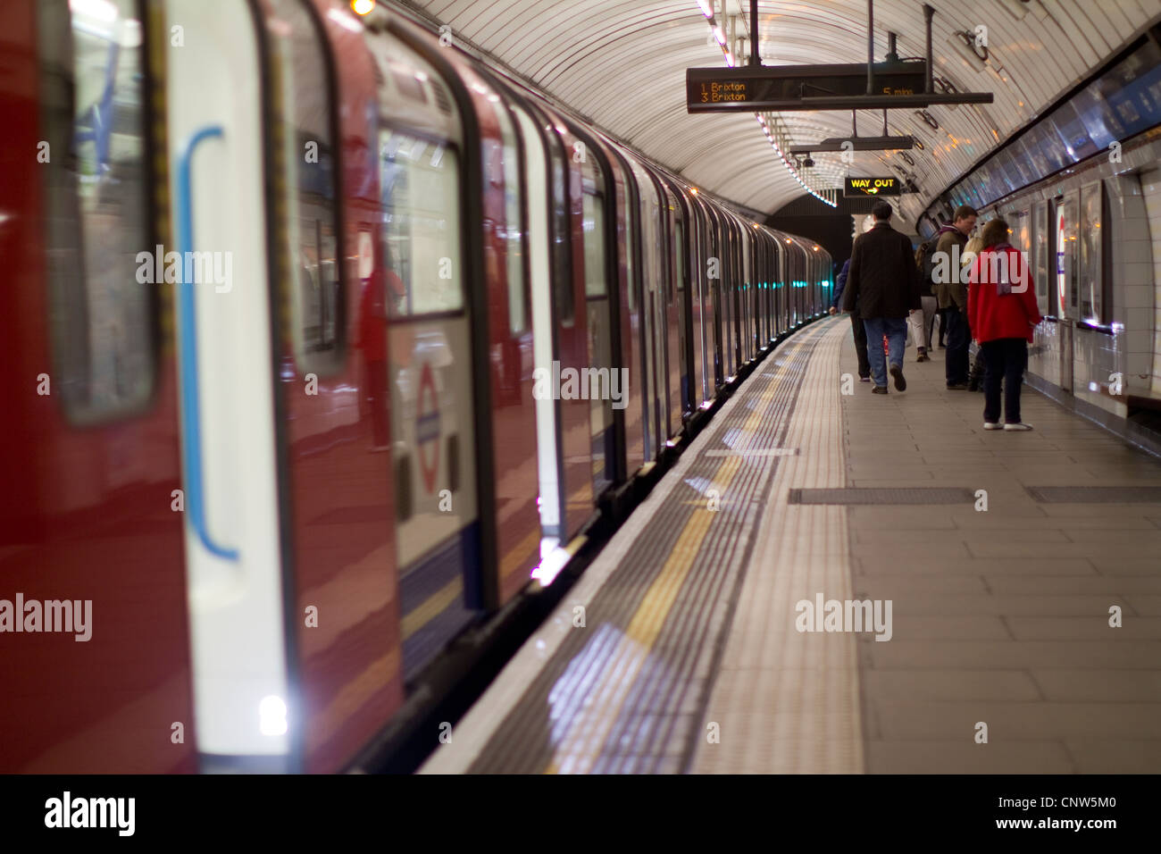 London Underground tube network, commuters getting on train on Victoria ...