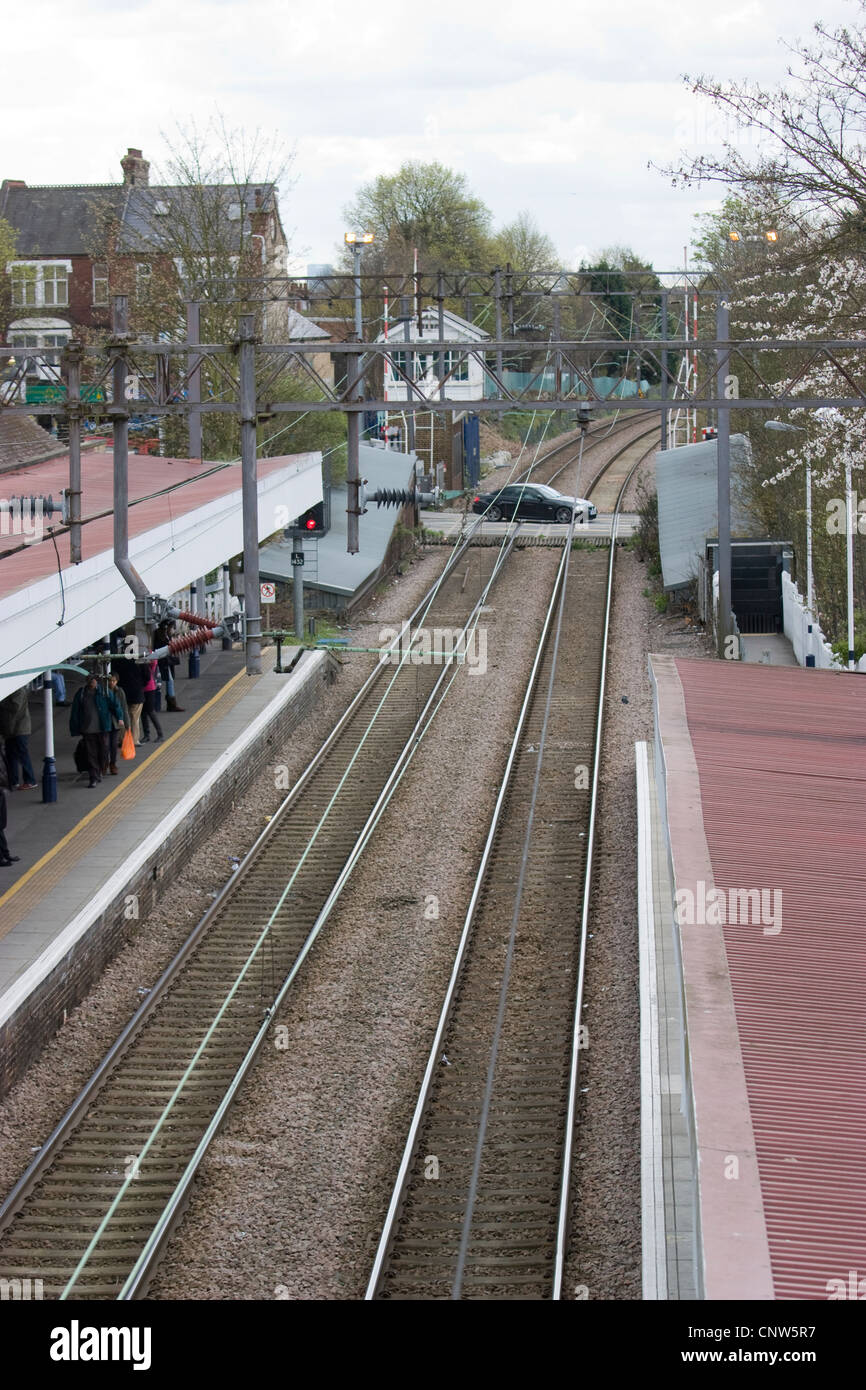 Highams Park Station level crossing and platform, North East London, UK ...