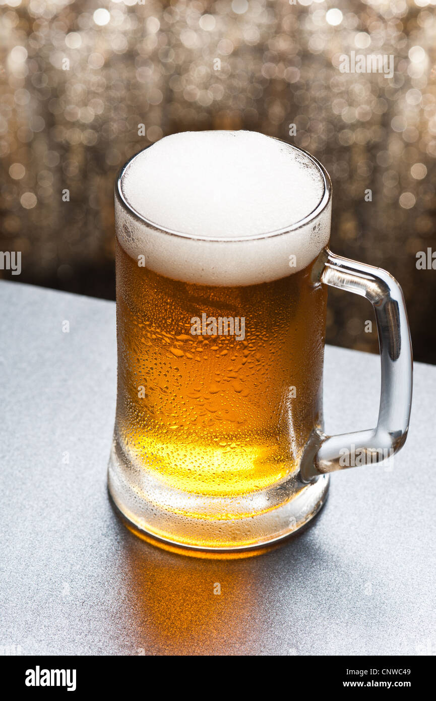 Beer mug in front of a glittering background with a cool beer Stock ...