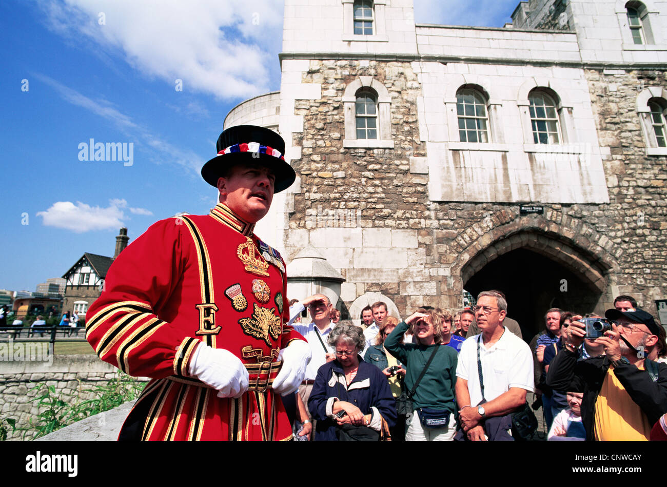 England, London, Tower of London, Beefeater in State Dress giving ...