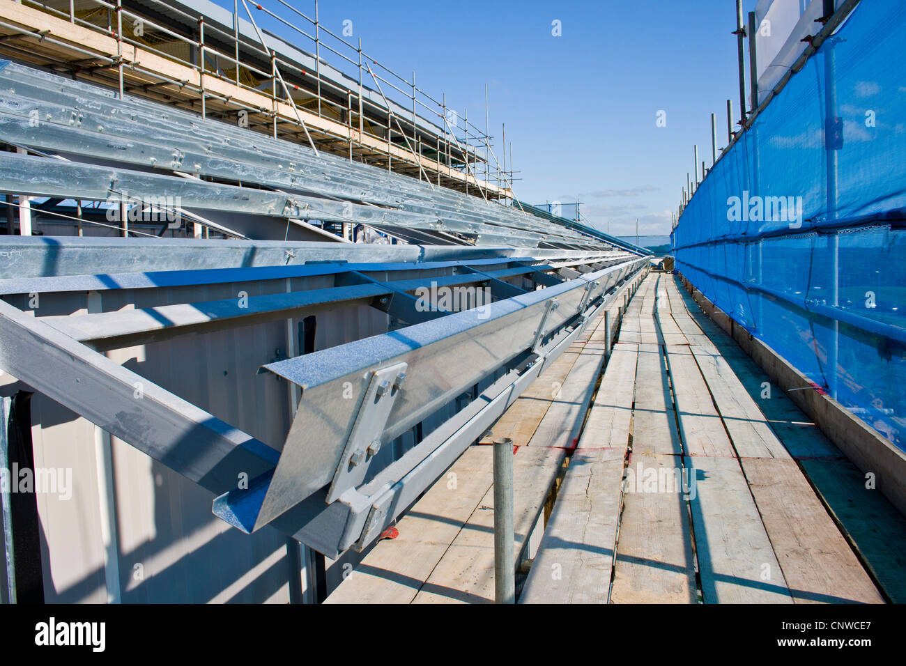 Building site scene with scaffolding and safety netting on an ...
