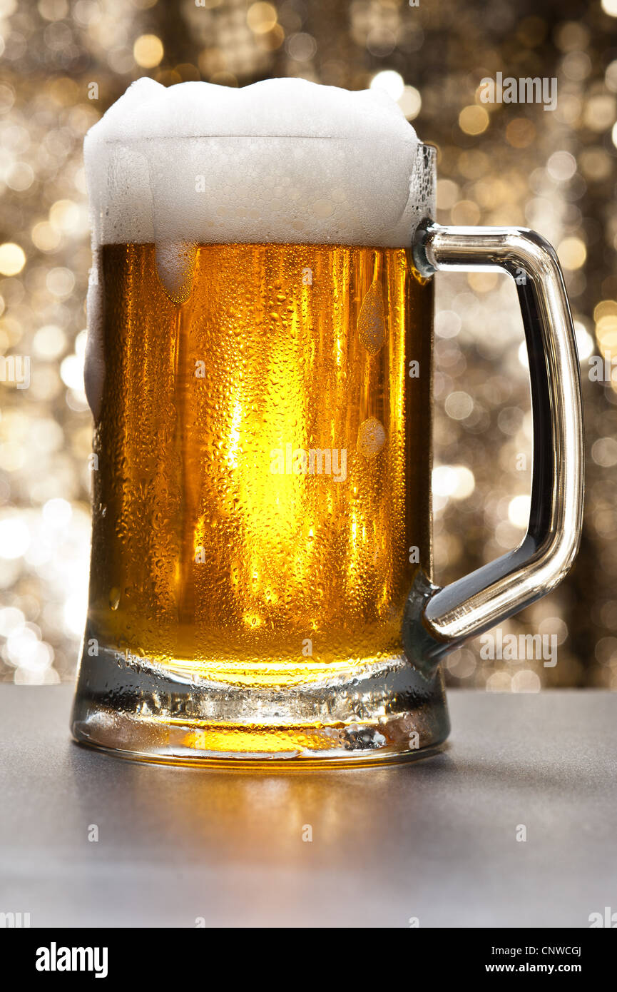 Beer mug in front of a glittering background with a cool beer Stock ...