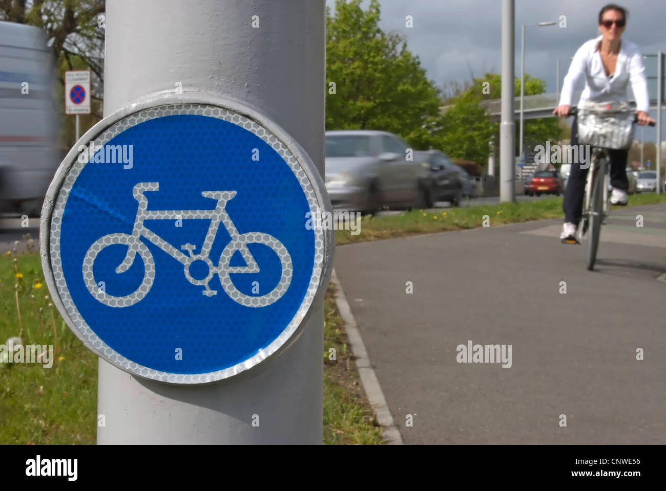 cycle lane sign with approaching female cyclist, richmond upon thames ...