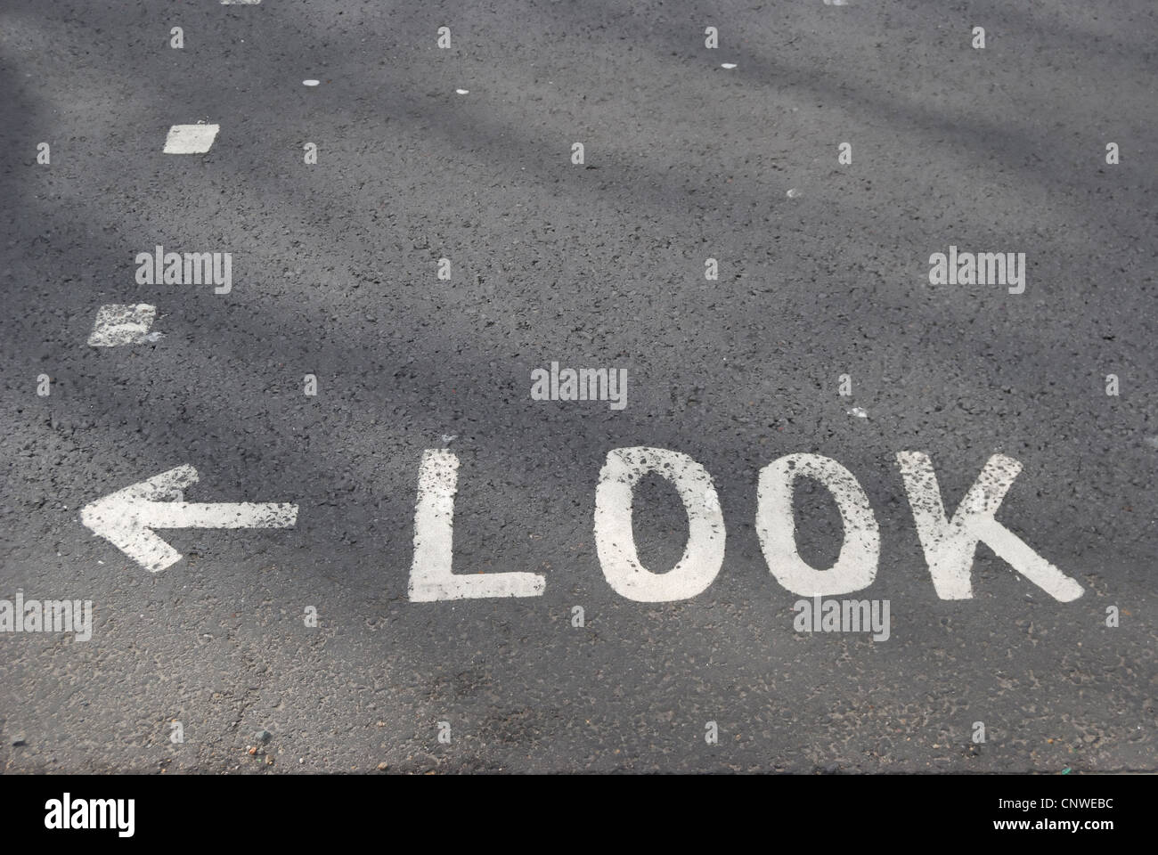 detail of look left british road marking Stock Photo - Alamy